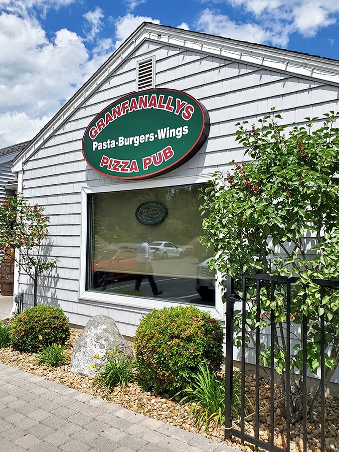 Behind that classic New England siding lies a pizza pub that perfectly balances neighborhood charm with serious culinary credentials.