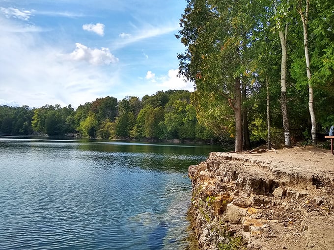 Secret quarry waters reflect the forest like nature's own mood ring&mdash;turning from blue to green with Wisconsin magic.