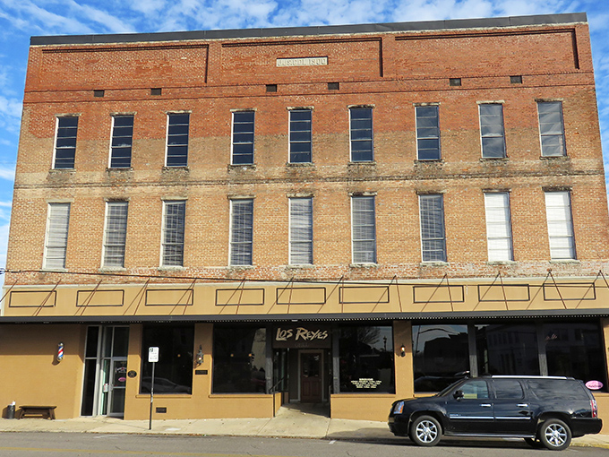 Weathered brick facades tell stories of resilience through decades of change and growth.