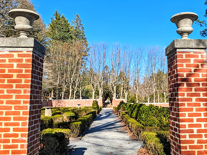 Maudslay's formal gardens meet wild nature. These brick pillars mark the entrance to a world of cultivated beauty.