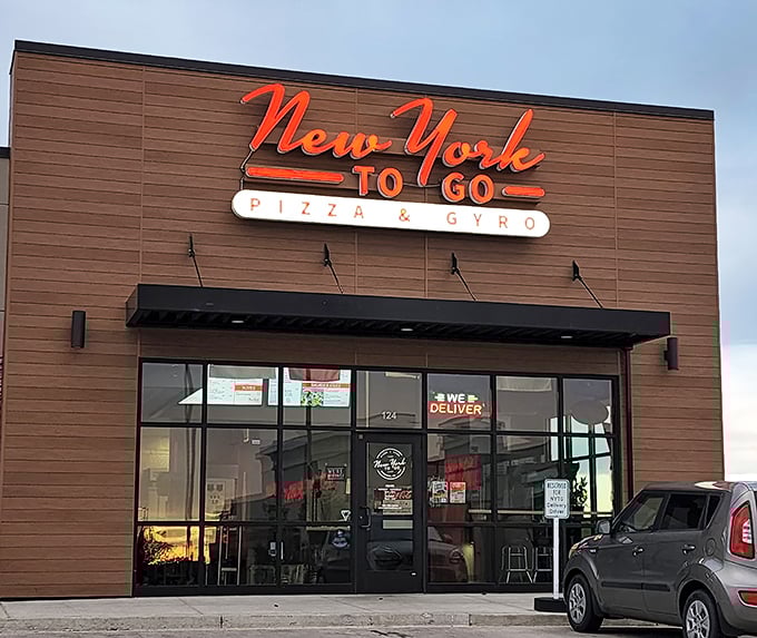 That sleek storefront design promises genuine New York-style pizza without the Manhattan attitude or prices.