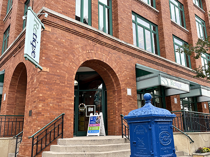 The classic architecture and stylish signage of Retique hint at the curated fashion treasures waiting inside.