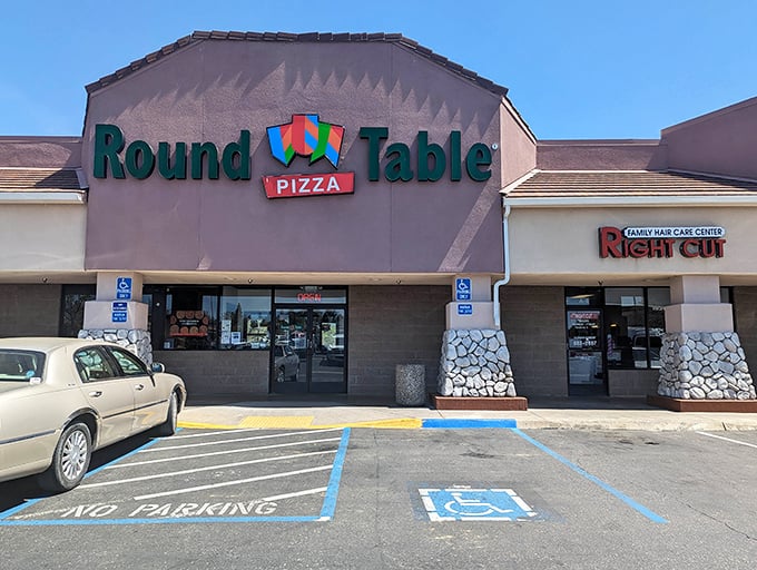 The familiar Round Table sign promises "the last honest pizza" to weary travelers and locals in the gateway to Yosemite.