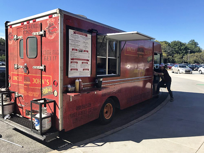That red truck carries more than food; it's spreading barbecue joy one perfectly smoked rib at a time.
