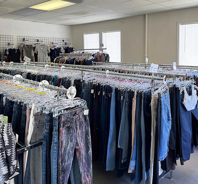 Rows of organized clothing racks prove that thrift stores can be both massive and manageable simultaneously.