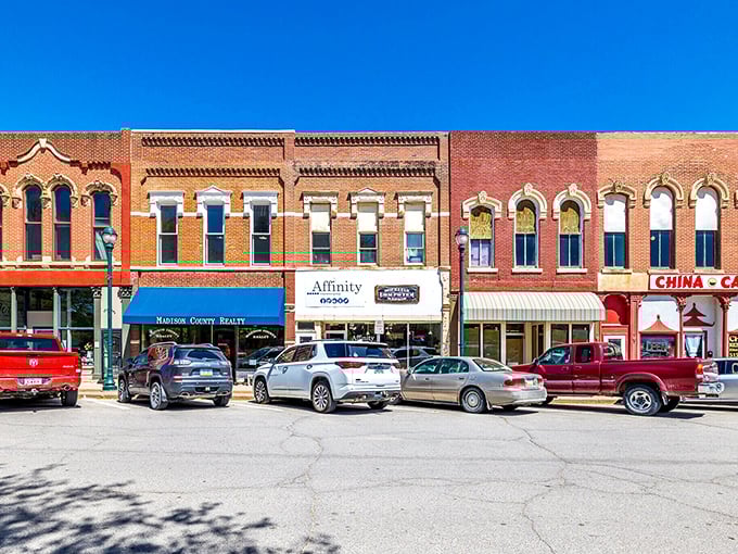 The limestone courthouse anchors Winterset's town square like a grand old dame. John Wayne's hometown knows how to make an architectural statement!