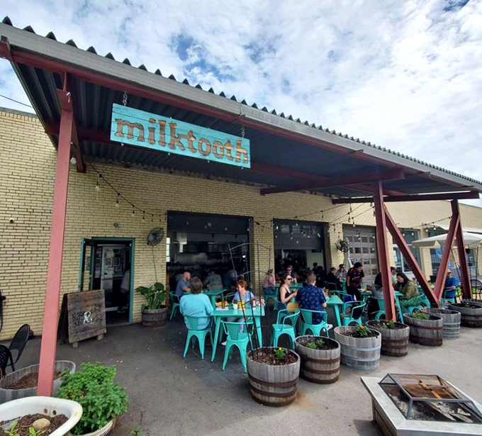 The bustling patio at Milktooth shows why people line up for breakfast here. Those turquoise chairs have held some very happy breakfast enthusiasts.