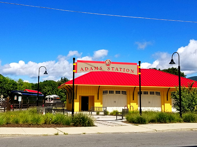 The cheerful red roof of Adams Station pops against blue Berkshire skies, a colorful reminder of the town's railroad heritage.