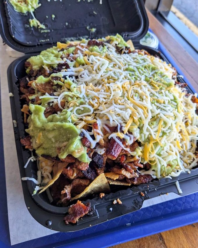 This isn't just a plate of nachos&mdash;it's an archaeological dig where each layer reveals new treasures of cheese, meat, and guacamole.
