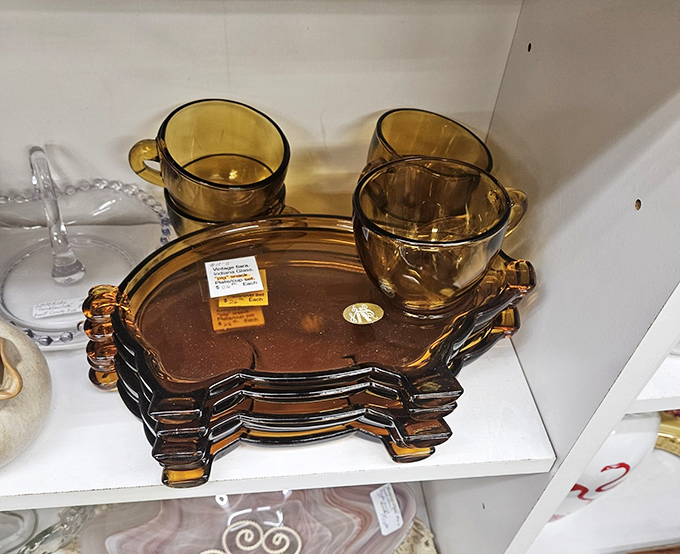 Amber glassware that captures light like liquid honey&mdash;these snack sets hosted bridge clubs and gossip sessions long before Netflix existed.