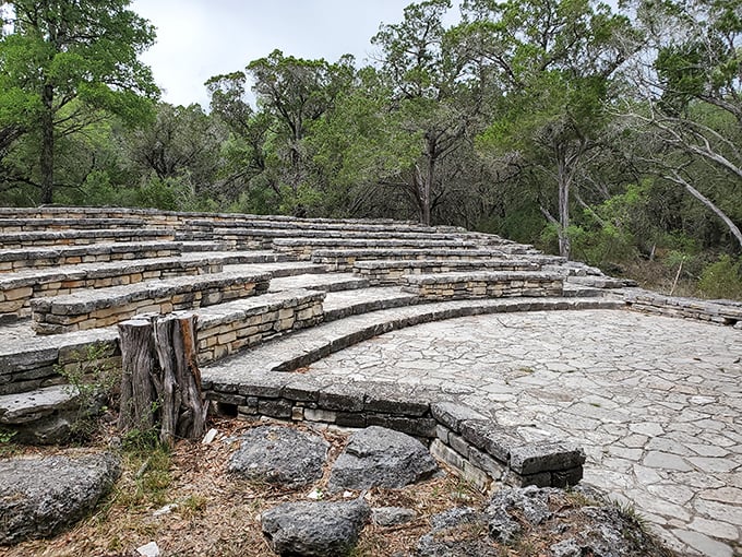 The stone amphitheater waits for its audience, a place where ranger talks become theater and stars provide the overhead lighting.