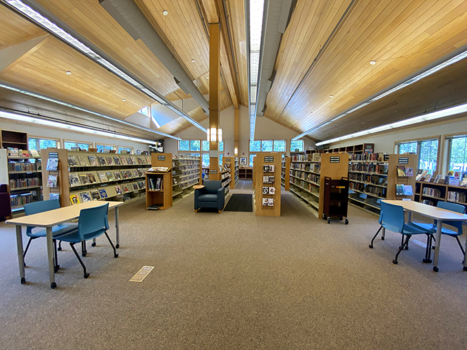 Girdwood's library proves that even intellectual pursuits deserve architectural inspiration from the surrounding wilderness. Those ceilings!