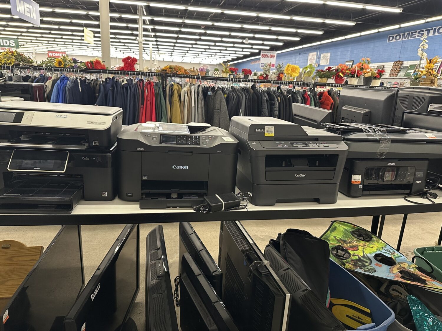 The electronics section transforms yesterday's tech into today's bargains, where printers and monitors await their second chapter of usefulness.
