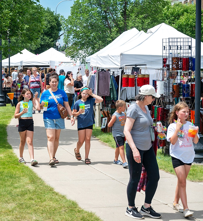 Art in the Park transforms ordinary sidewalks into bustling marketplaces where creativity and commerce dance together beautifully.