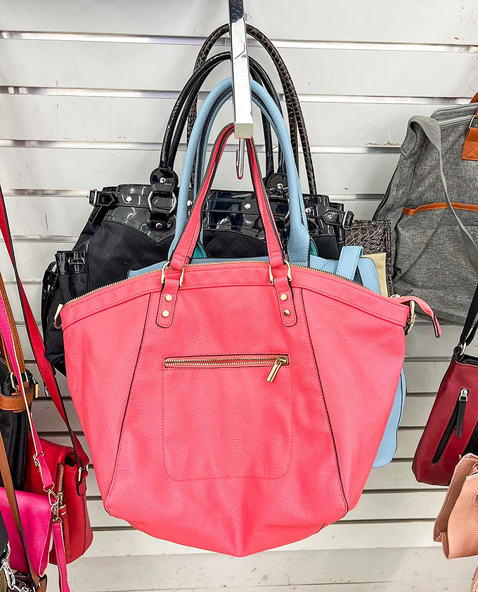 Handbags in every hue hang like ripe fruit, that coral tote practically screaming "Summer!" even in the depths of January.