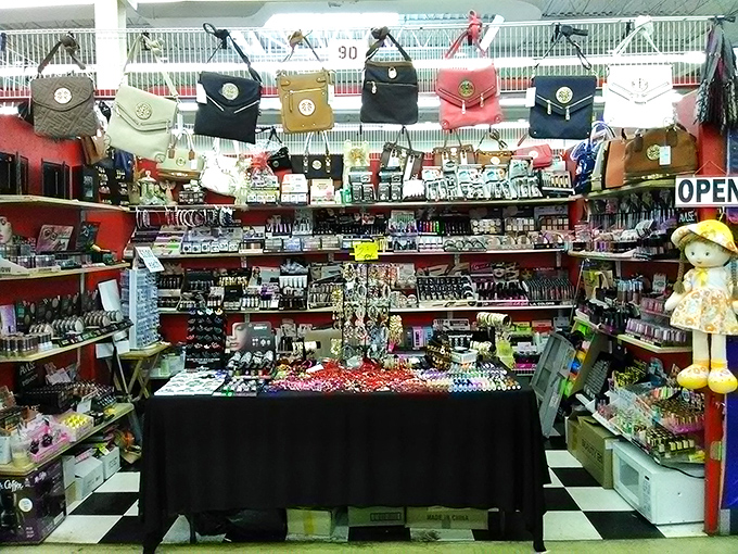 Handbag heaven hanging from the ceiling like fashionable stalactites. Every color, every style, none requiring an installment plan to purchase. 