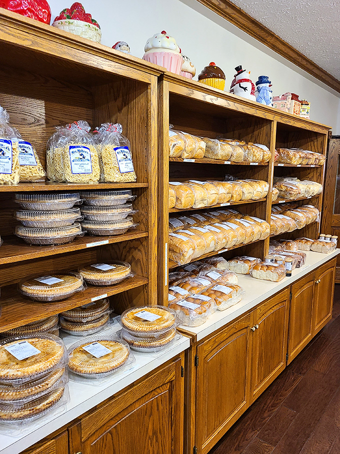 The bakery display—where willpower goes to die and diet plans are forgotten amid shelves of homemade pies and freshly baked bread.