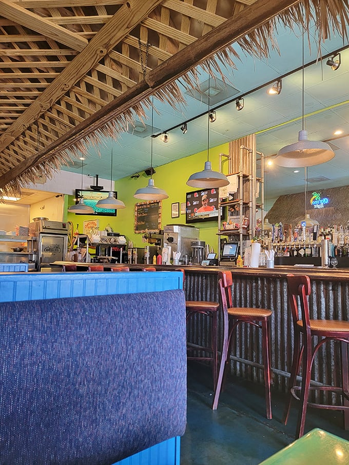 Bright lime-green walls and bamboo accents frame the bar, where pendant lights dangle like beacons guiding you to burger nirvana.