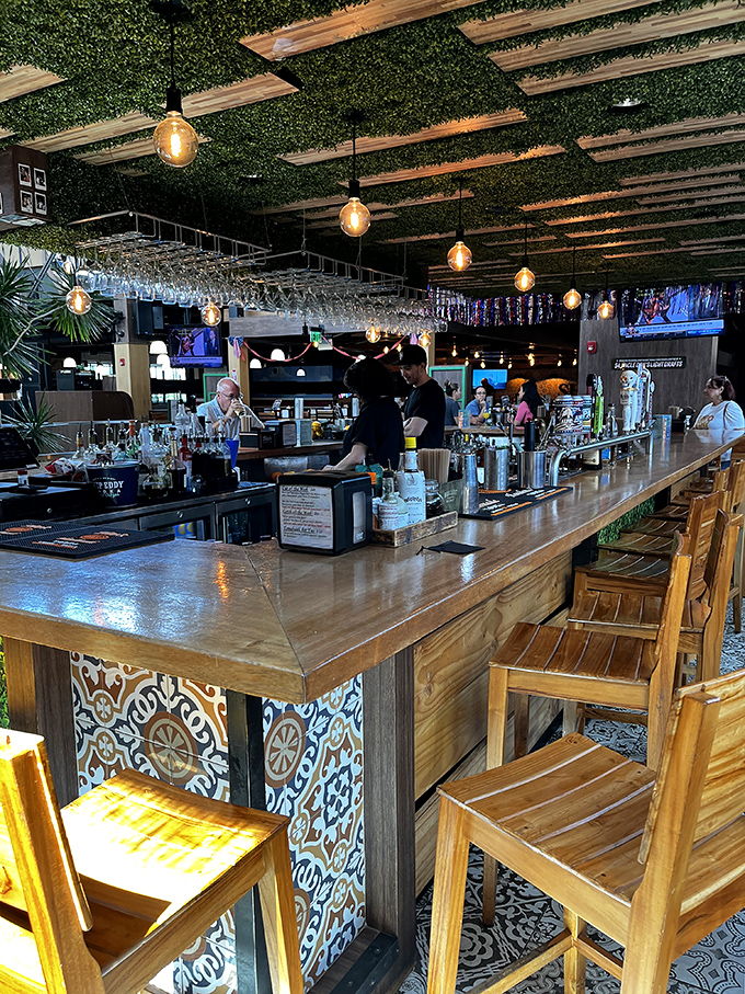 A bar topped with greenery proves that even seafood joints can embrace their botanical side with style.