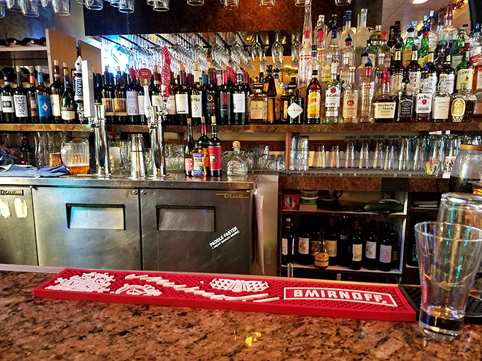 A well-stocked bar stands ready to pour whatever beverage pairs perfectly with your chicken parmesan adventure tonight.