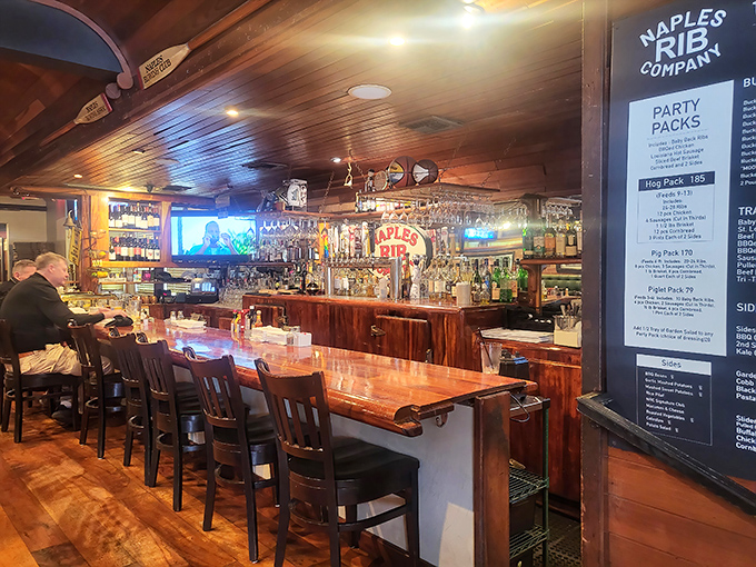 A polished wooden bar where barbecue dreams come true and the bartenders know the difference between good and exceptional.