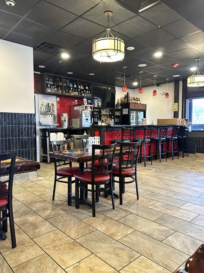 The bar area promises liquid happiness with rows of bottles standing at attention. Where tequila dreams and lime wedges come together in perfect harmony. 