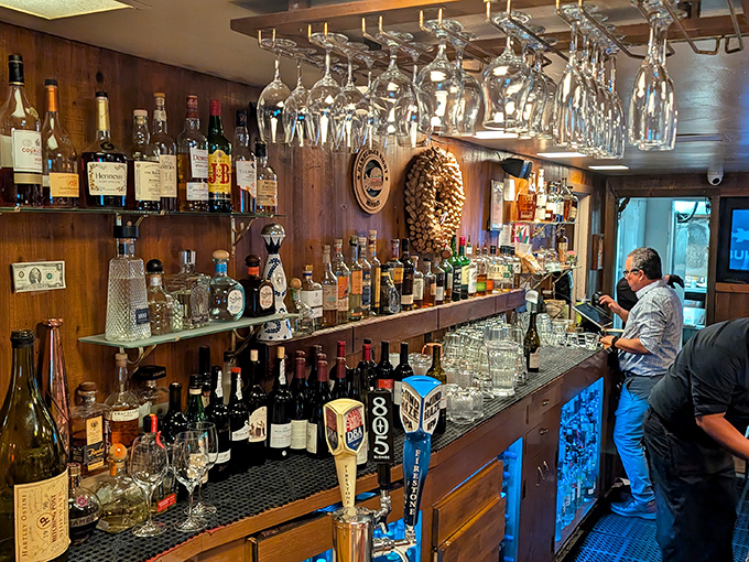 A bar stocked with enough spirits to raise yours. The kind of place where bartenders remember your name and your usual after just one visit.