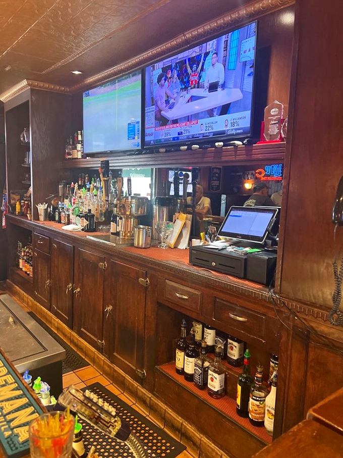 A bar area where the wood is worn just right, the bottles are arranged with purpose, and everyone eventually learns your usual order.