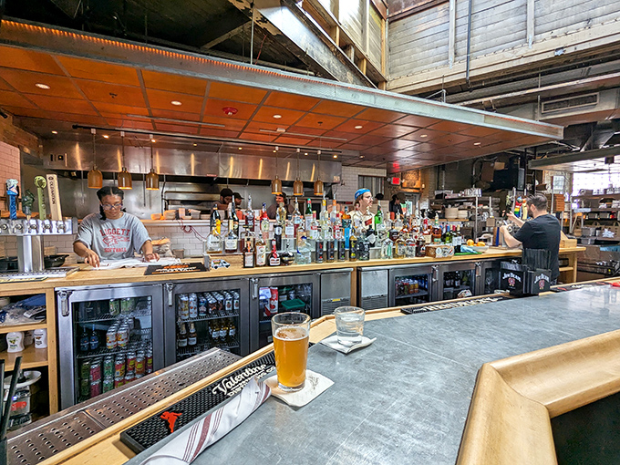 The bar stretches long and inviting, stocked with enough options to keep any decision paralysis in overdrive.