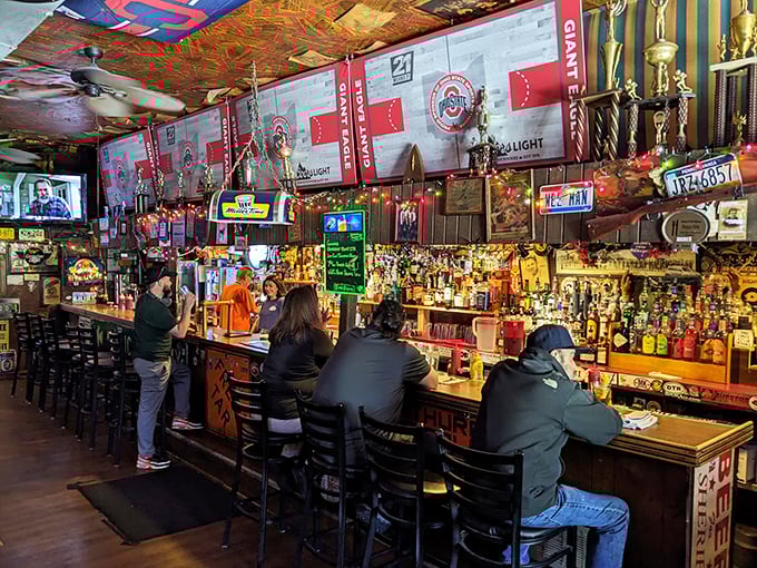 The bar isn't just stocked&mdash;it's a shrine to good times. Those Ohio State banners aren't decoration; they're a statement of local allegiance.