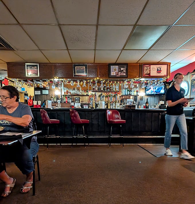 The bar glows like a stage set for your favorite memories, complete with vintage charm.