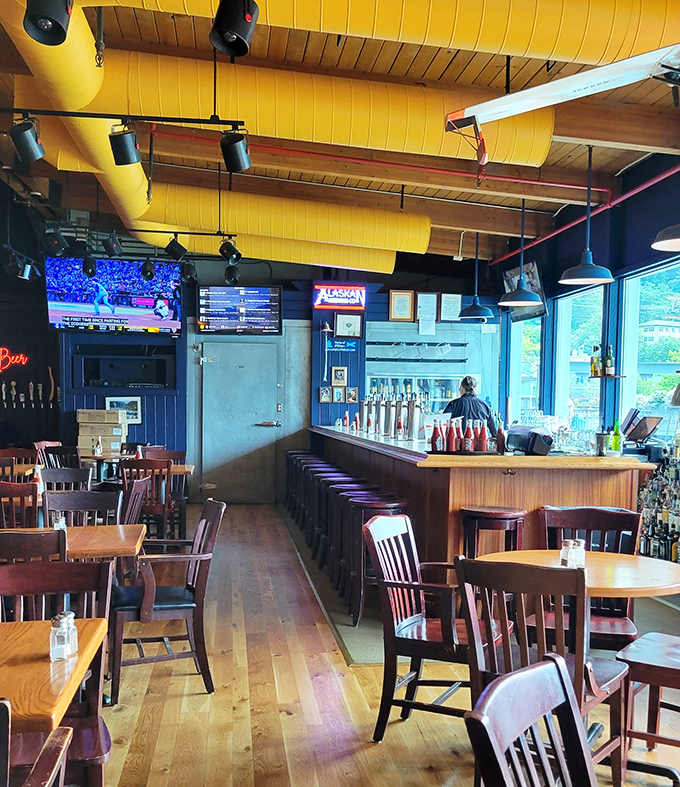 A bar area where the beer taps stand ready like old friends waiting to hear about your day. Those windows frame nature's best artwork.