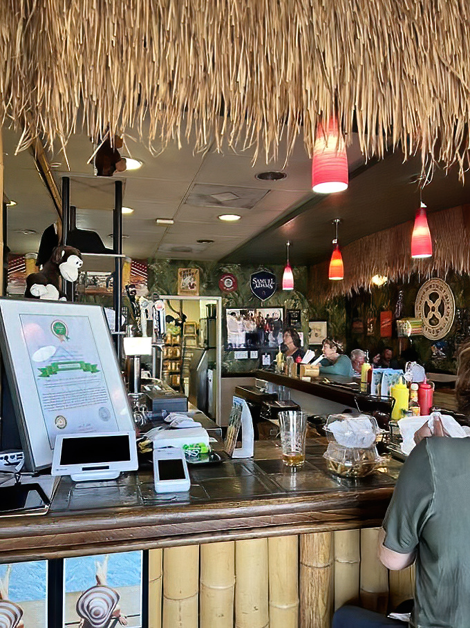 The bamboo-clad bar serves up cold drinks and nostalgia with colorful pendant lights setting the mood.
