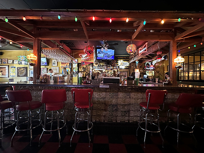 The bar area glows with neon signs and holiday lights year-round. Where Ole Miss victories are celebrated and defeats are drowned.
