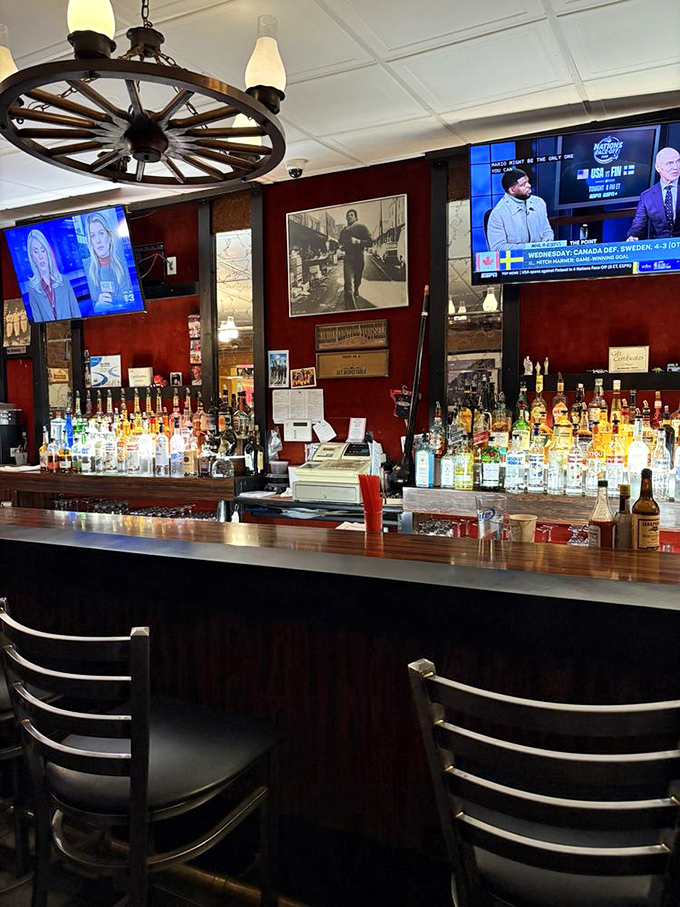 The bar area doesn't just serve drinks—it serves stories, with a wagon wheel chandelier overhead that's seen decades of celebrations.