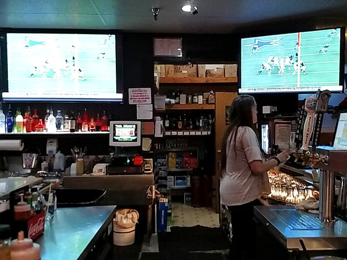 The bar area serves as Juneau's unofficial town hall, where pints and opinions flow freely beneath the glow of sports on TV.
