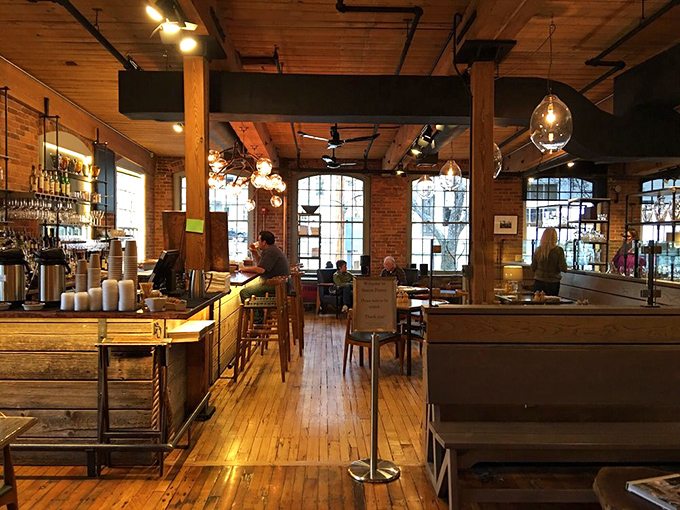 The bar area glows with amber warmth, like something from a Hemingway novel where everyone has excellent taste in spirits.
