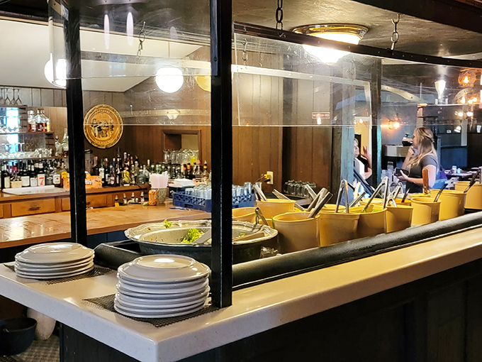 The salad bar and beverage station stand ready for action, like the backstage crew that makes the main performance possible.