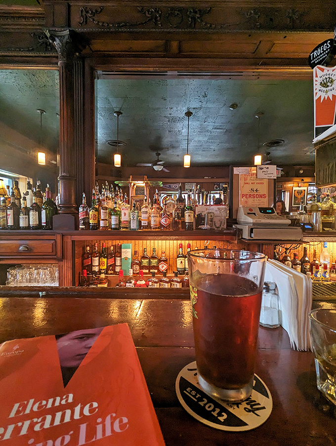 Behind every great tavern is a bar that tells stories through its bottles, wood grain, and the careful arrangement of decades-collected memorabilia.