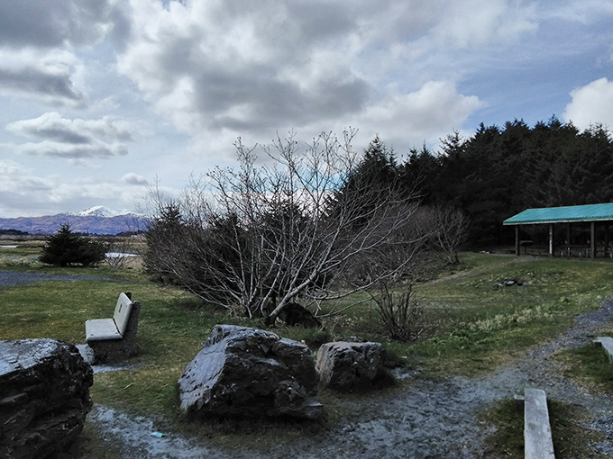A thoughtfully placed bench invites contemplation with mountain views that make small problems suddenly seem very small indeed.