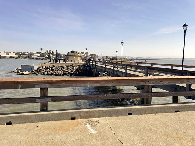 The public pier stretches into the strait like an invitation to slow down and remember why waterfront towns have soul.