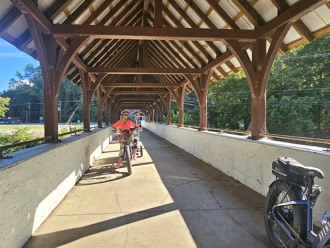 Cyclists discover the joy of pedaling through history, where the rhythmic sound of tires on planks creates its own kind of mountain music.