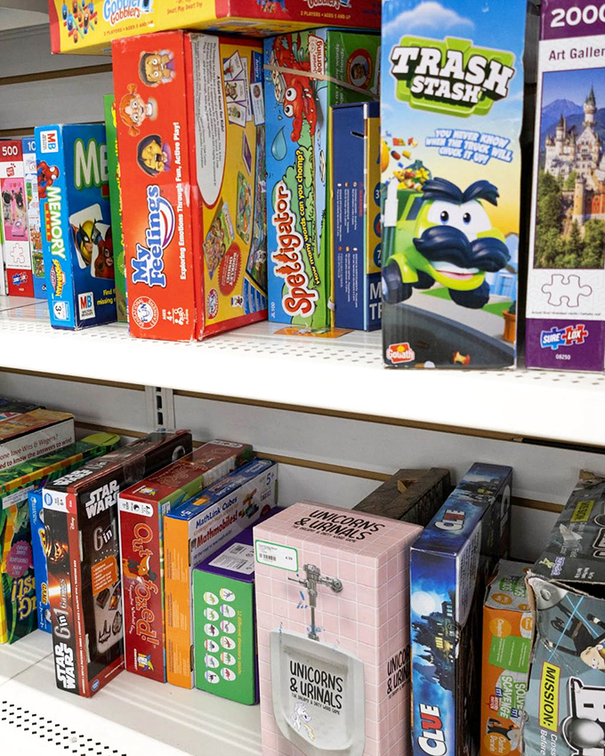 Board games and puzzles await new families – that "Unicorns & Urinals" box proves thrifting delivers surprises you'd never find at big box stores.