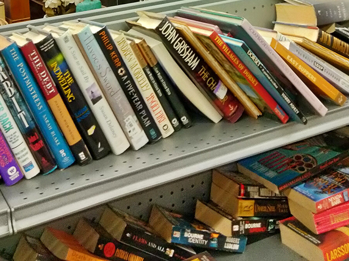 Literary treasures stacked spine-to-spine. John Grisham rubbing shoulders with Julia Child&mdash;a bookstore where bestsellers cost less than your morning latte.