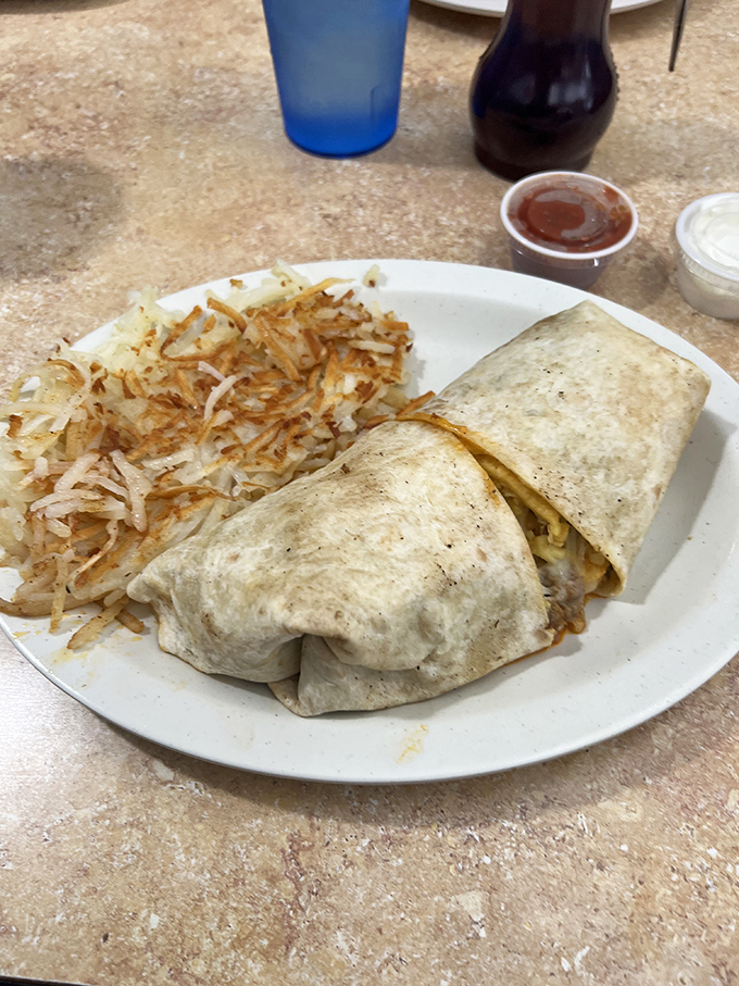The breakfast burrito &ndash; where morning ingredients hold their delicious meeting wrapped in a tortilla boardroom, with crispy hash browns as the perfect sidekick.
