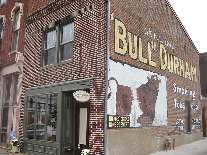 That Bull Durham tobacco sign has outlasted several generations of smokers. Vintage advertising as public art—Madison Avenue meets Main Street America.