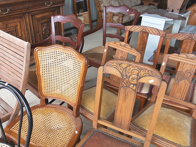 Chair congregation where every seat tells a different story. That cane-back beauty is just waiting to class up your dining room.