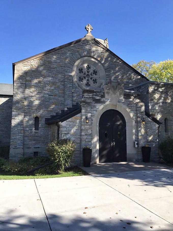 The historic chapel's stone facade and stained glass window offer a moment of architectural appreciation amid your nature-focused day trip.