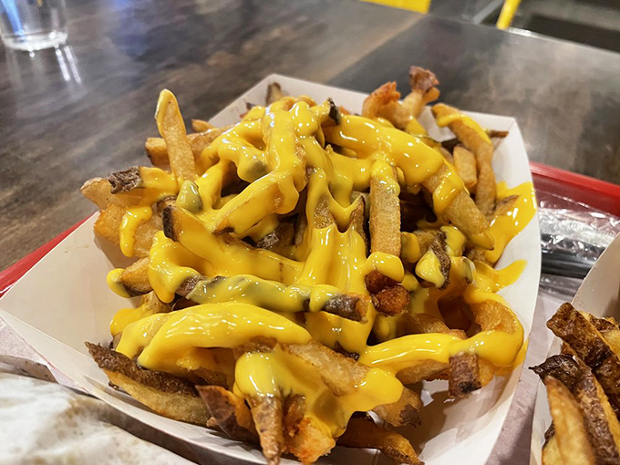 Cheese fries that don't mess around&mdash;hand-cut potatoes transformed into vehicles for delivering molten cheese directly to your happiness center.