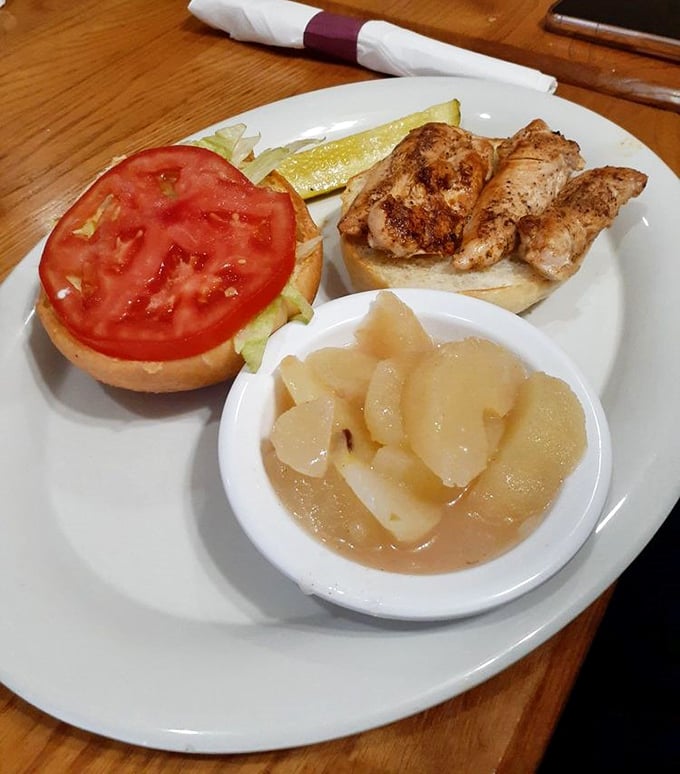 A grilled chicken sandwich that doesn't need fancy aioli or artisanal bread to impress&mdash;just honest flavor and those stewed apples that taste like childhood.